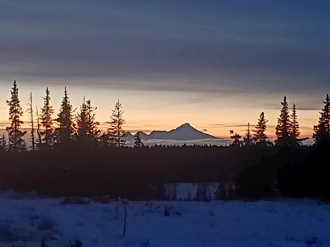 Distant volcano view across Cook Inlet, Alaska. | Scrolller