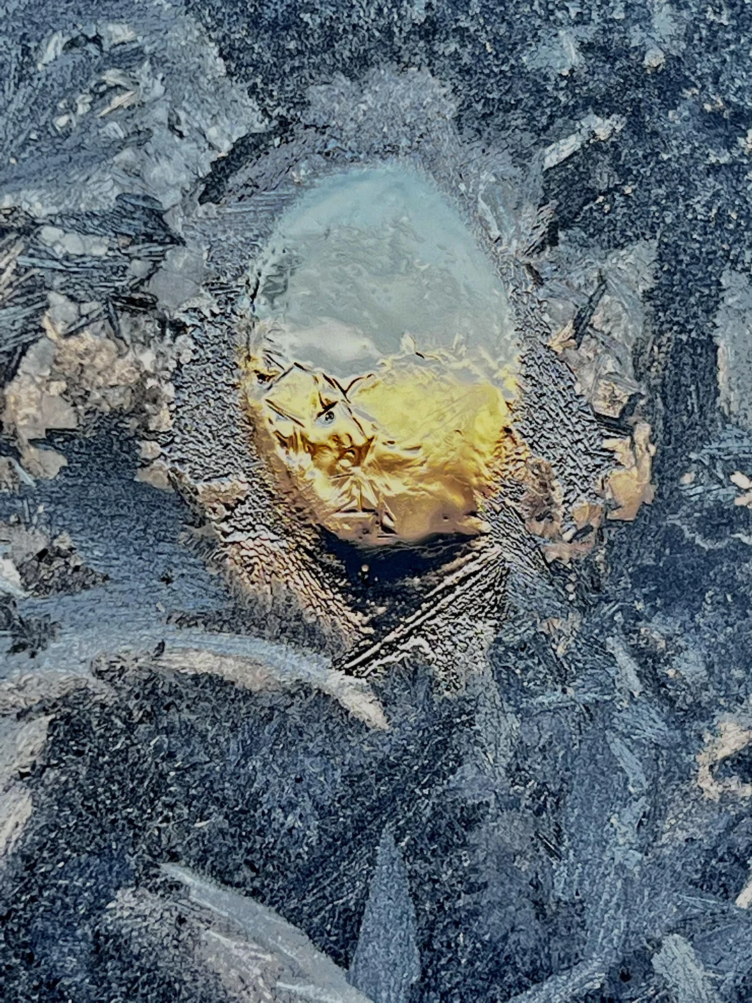 Frost on a window at sunrise, where a finger melts a spot and lets the sun in [OC] | Scrolller