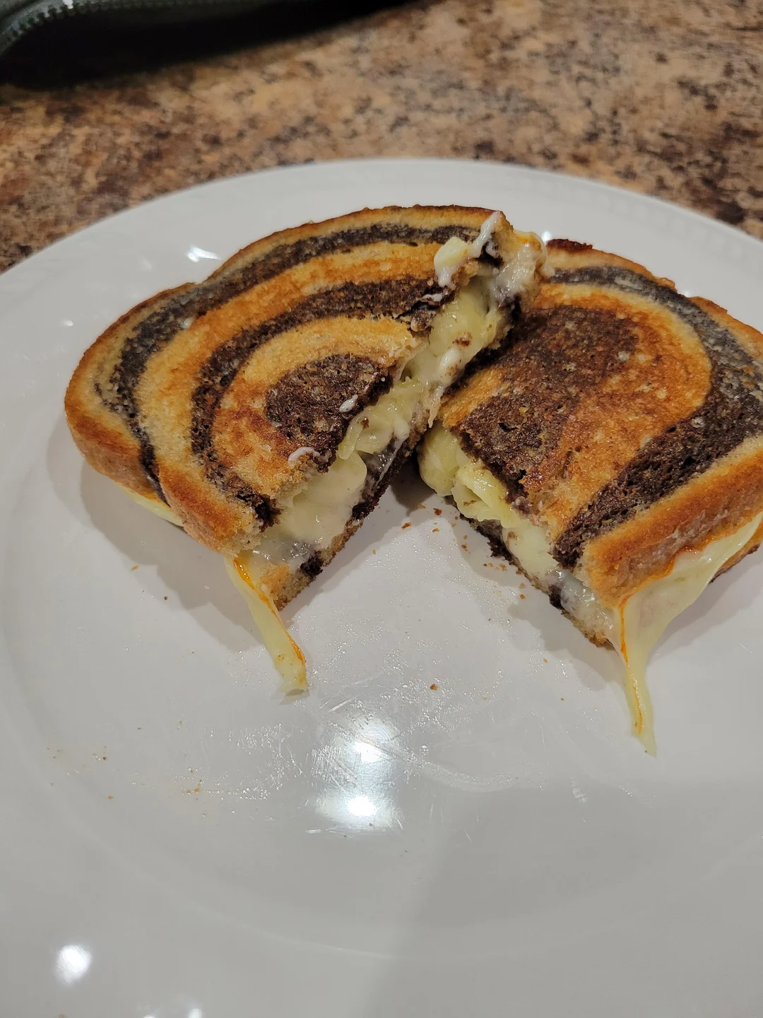Leftover mac and cheese (thanks to my kids), pumpernickel rye and muenster cheese | Scrolller