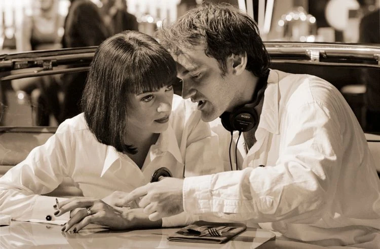 Quentin Tarantino directing Uma Thurman on the set of pulp fiction, 1994 | Scrolller
