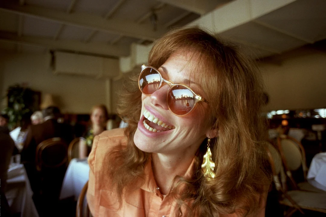 Carly Simon, with the Twin Towers reflecting off her glasses,1985 | Scrolller