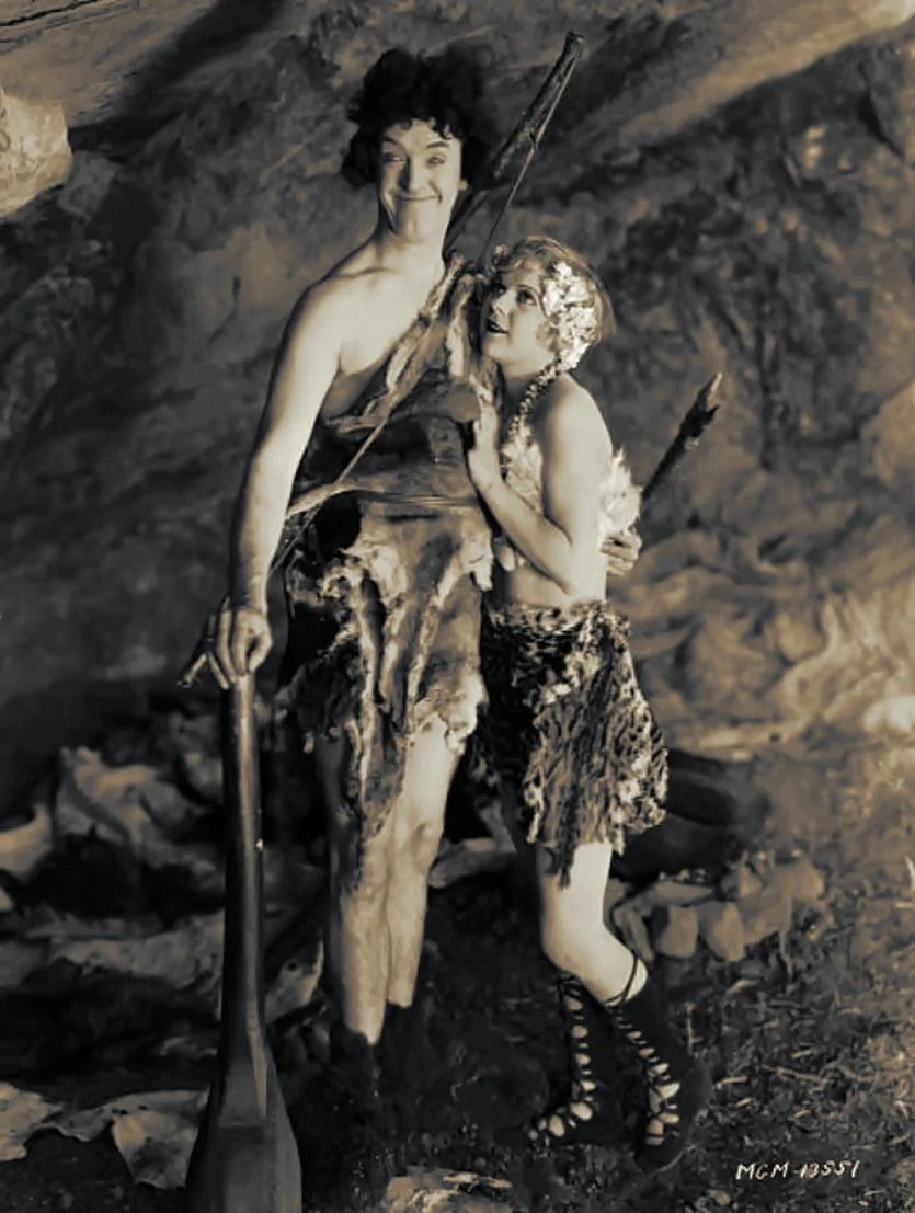 Neander-Stan Laurel with Edna Marion in a scene from 'Flying Elephants' 1927 | Scrolller