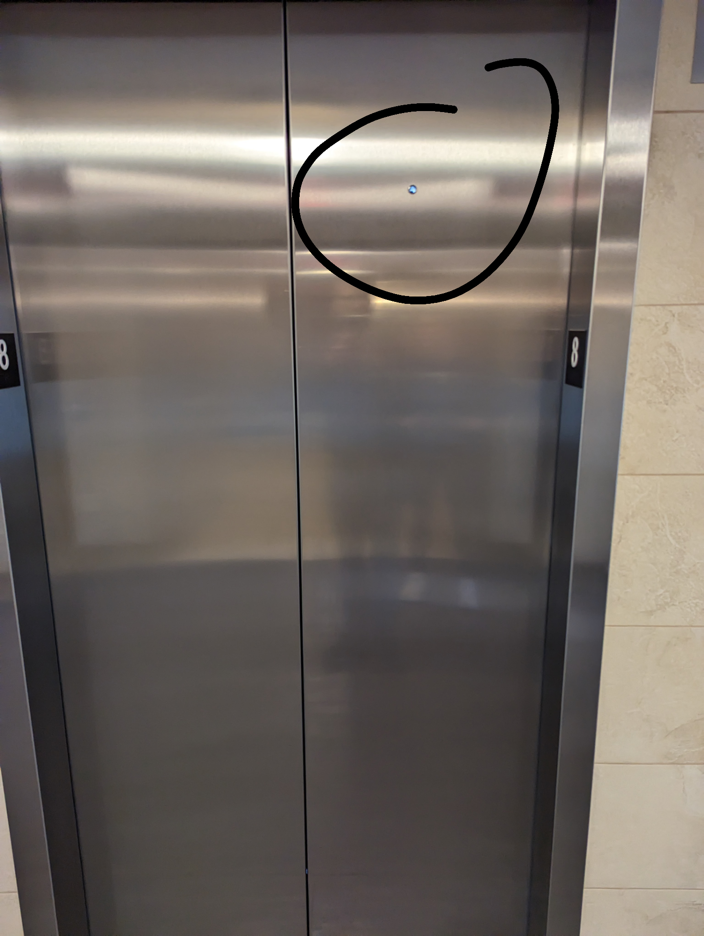 Peephole on an elevator | Scrolller