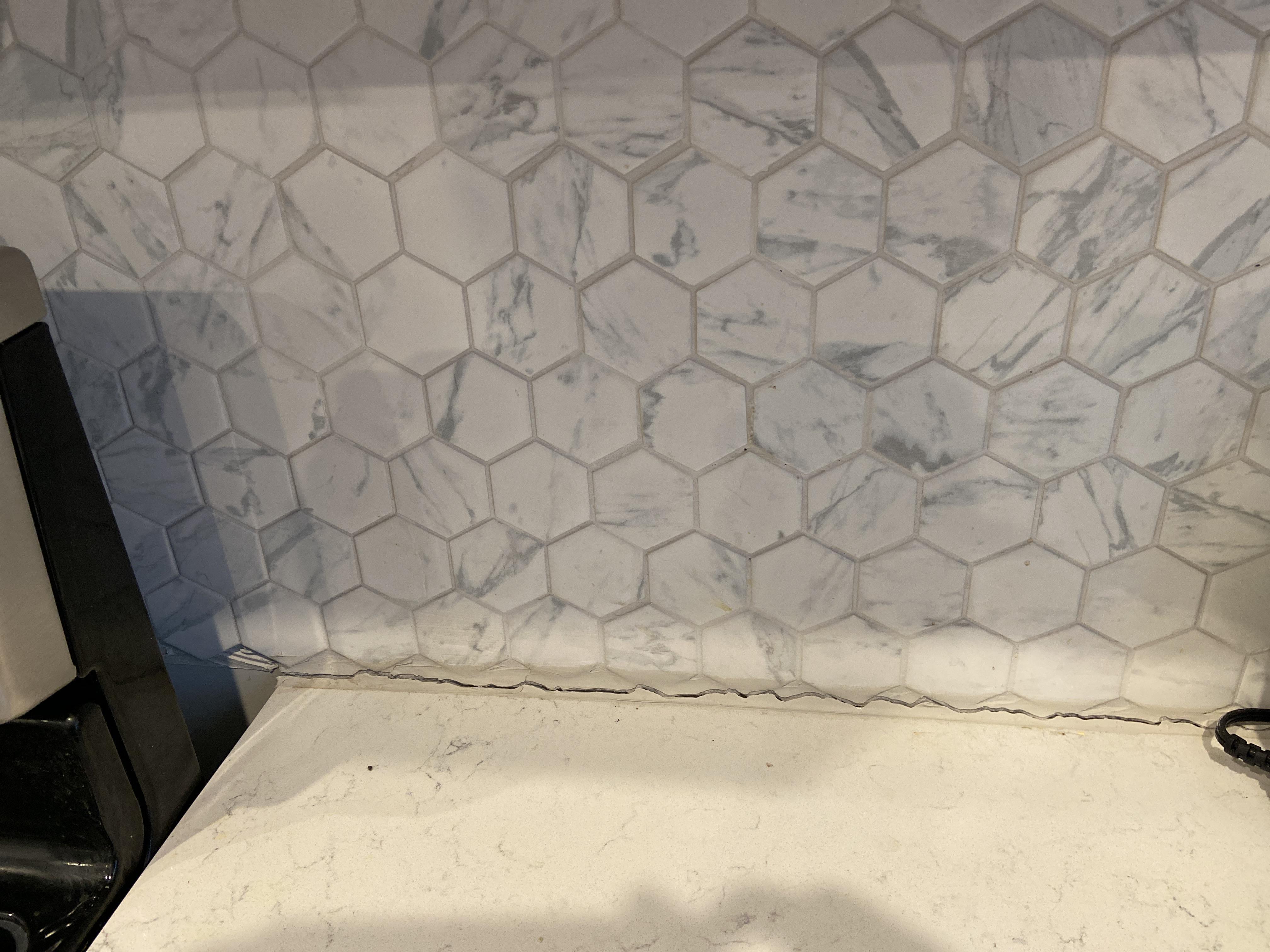 How do I fix the crack between counter top and backsplash? | Scrolller