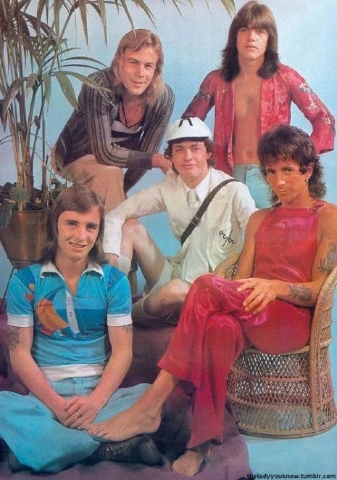 Rock band AC/DC with original lead singer Bon Scott in the 1970s | Scrolller
