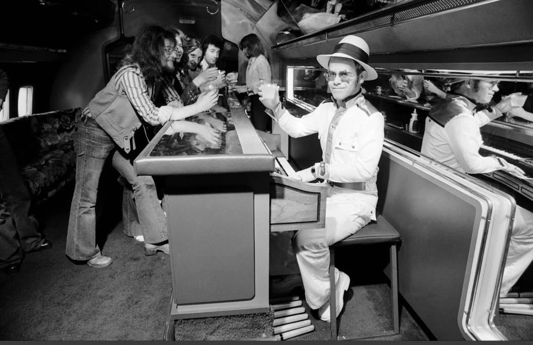 Elton John in his private jet with a private piano bar [1976] | Scrolller