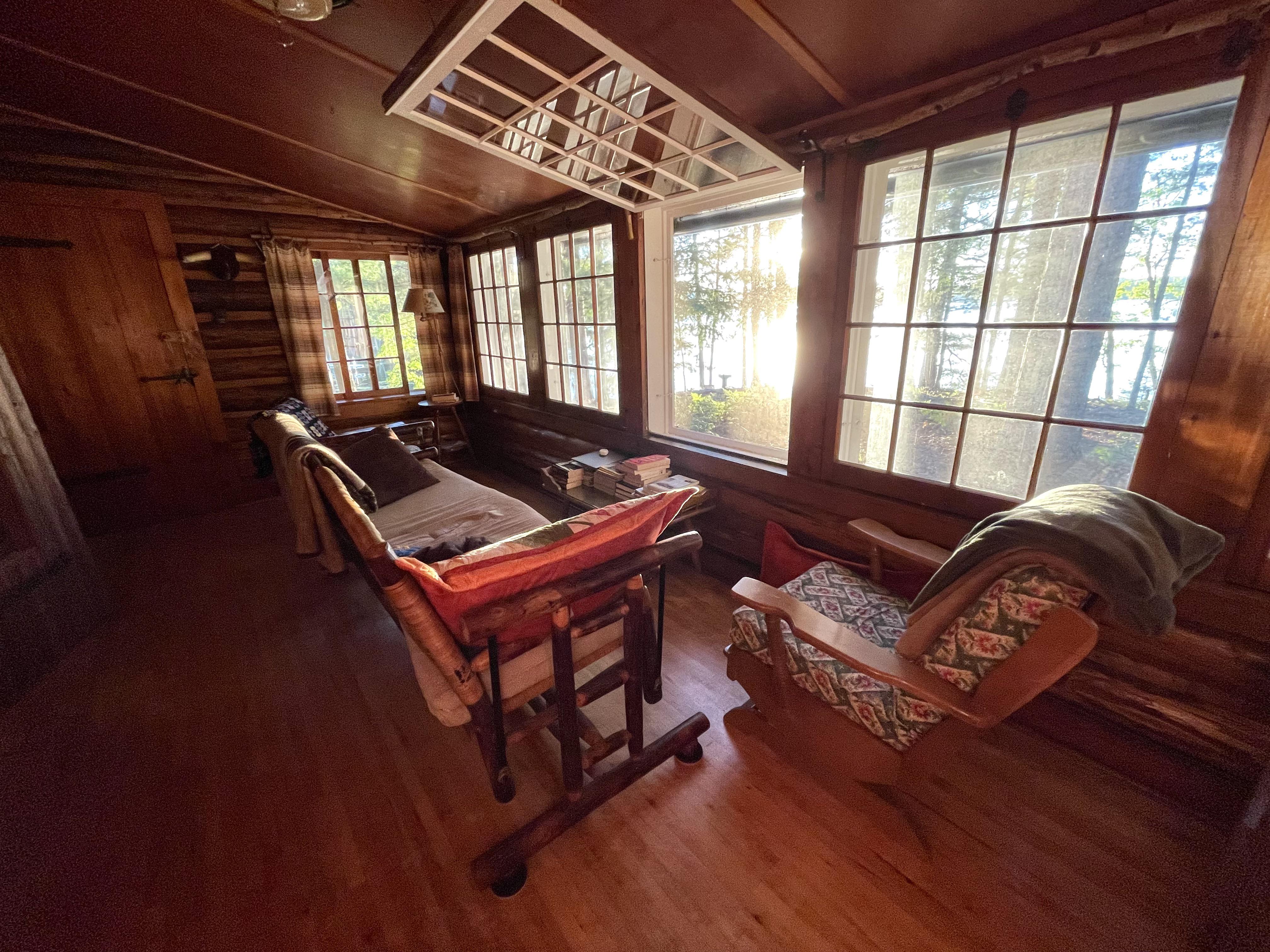 The front porch of our 92 year-old log cabin on Spider Lake, Wisconsin | Scrolller