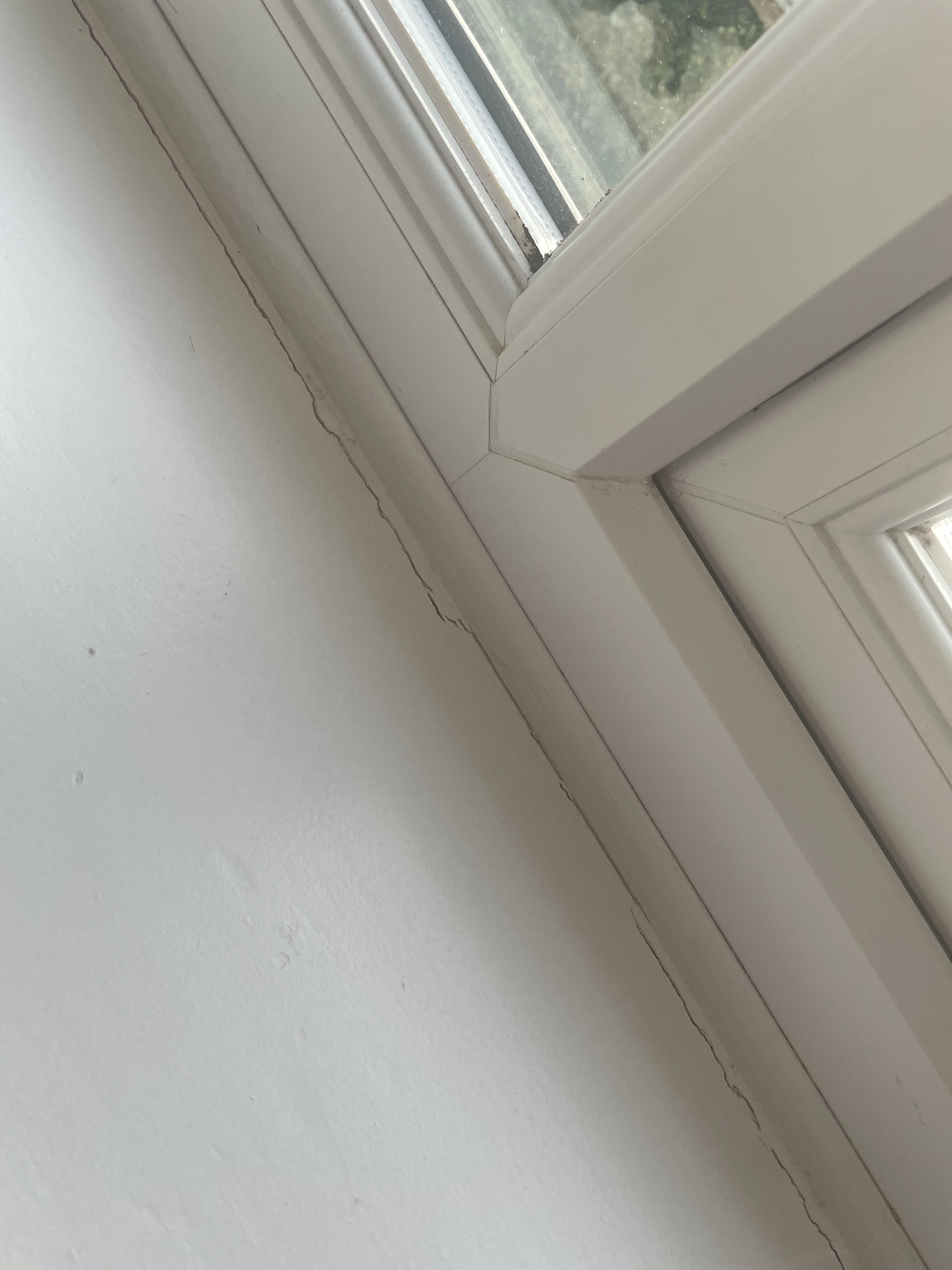 Cracks reappearing after being filled, then continue into the window ...