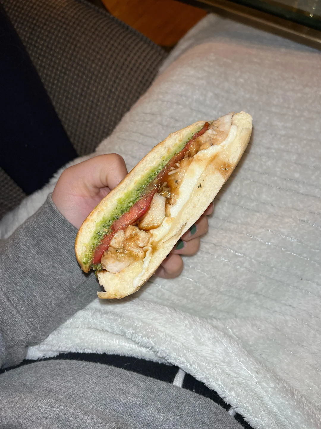 Caprese sandwich with mozzarella, chicken, tomato, pesto, and balsamic dressing on flatbread ...