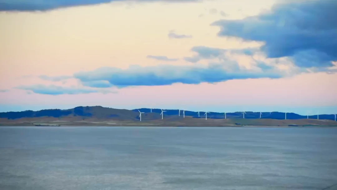 Tonights full moon rising over Lake George and the Tarago wind turbines, near Canberra. | Scrolller