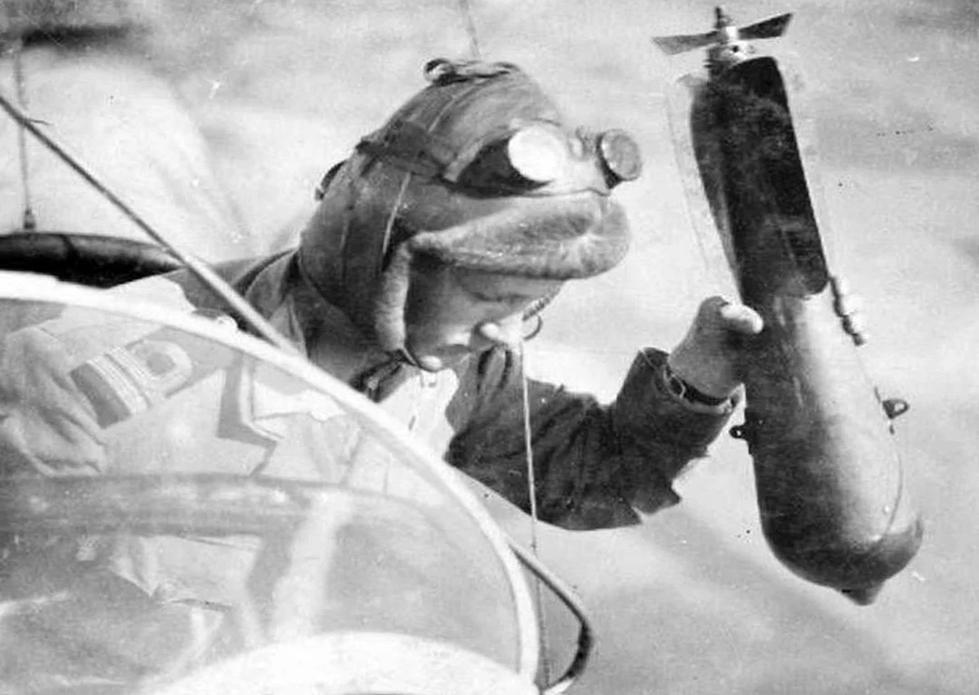 English military aviator dropping bombs, the Western Front, c. 1916. | Scrolller