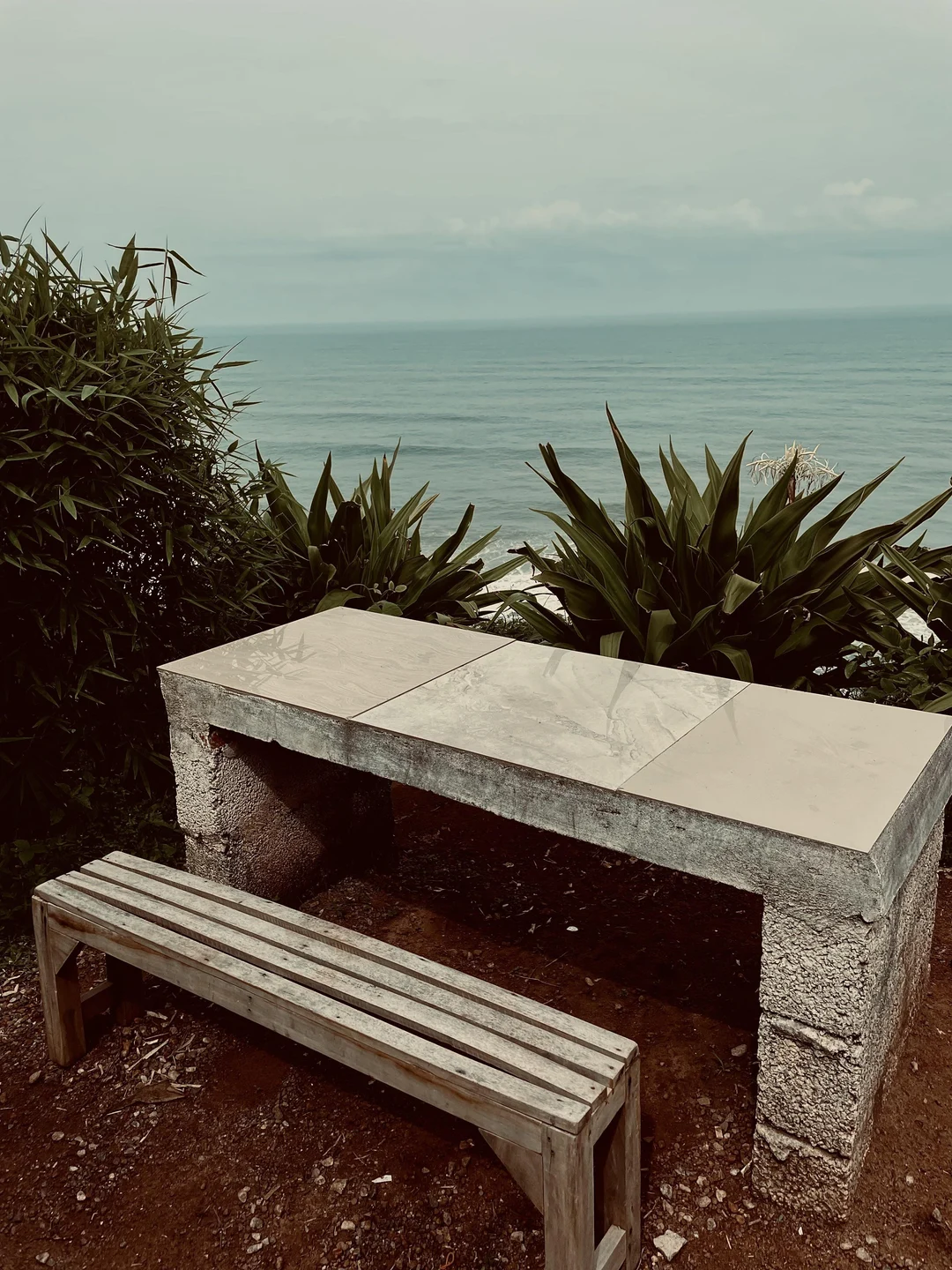 A bench outside of a oceanfront cafe in Varkala, India | Scrolller