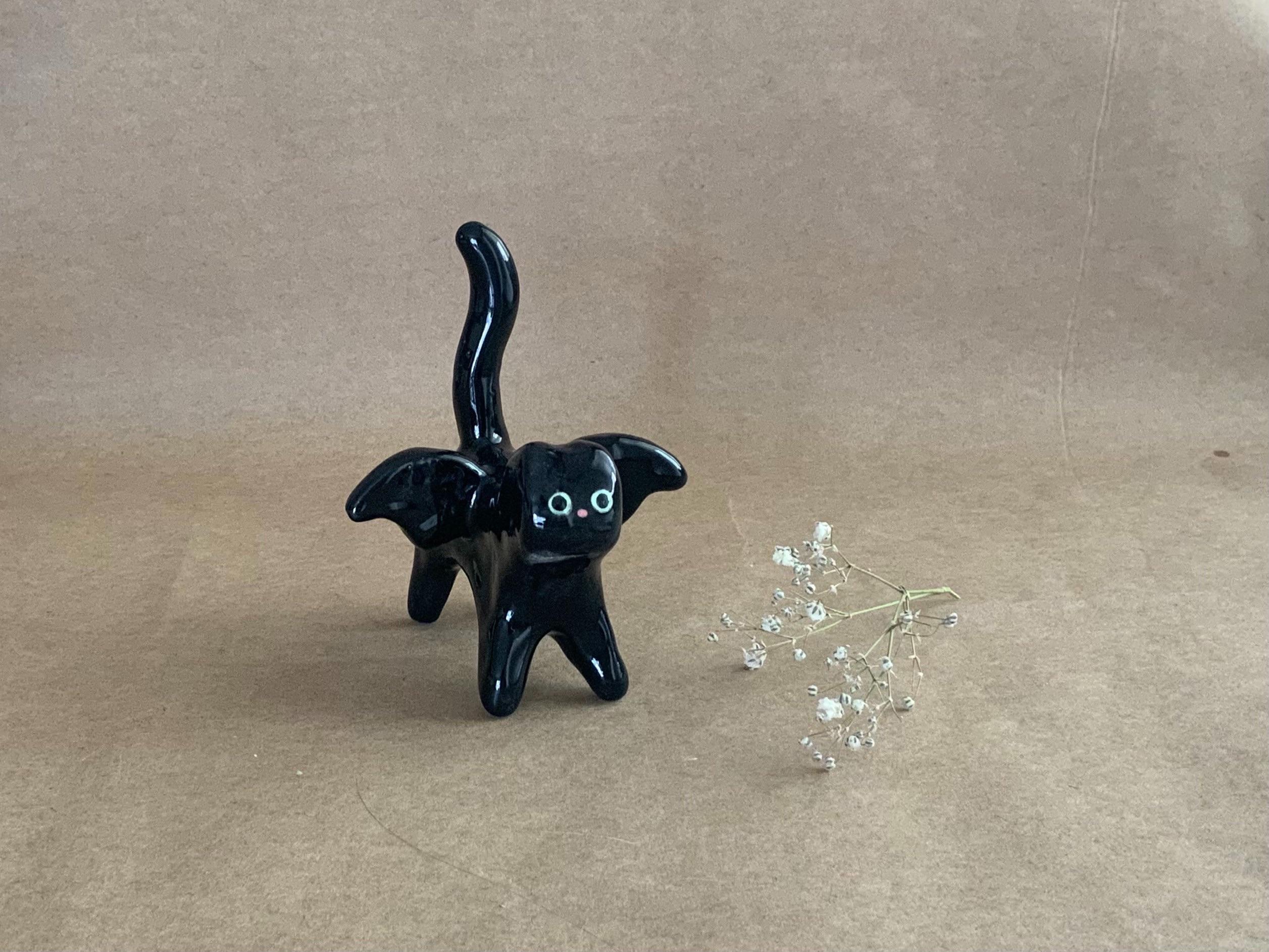 Ceramic batcat figurine | Scrolller