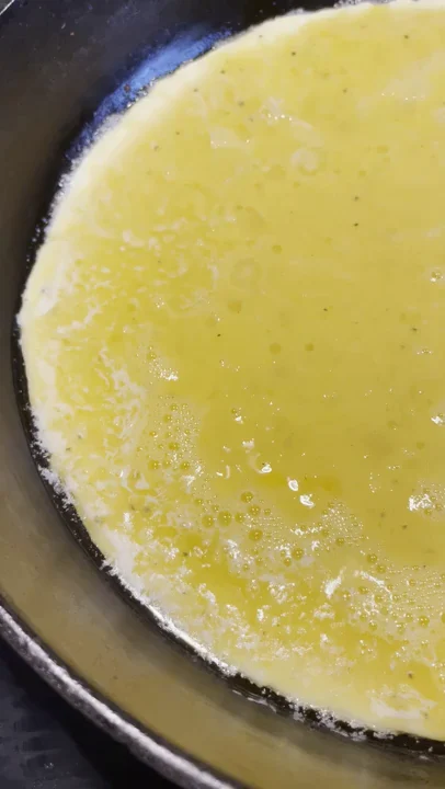 Scrambled eggs in a restored BSR Red Mountain cast iron pan. Pan used to be my grandma’s. This ...