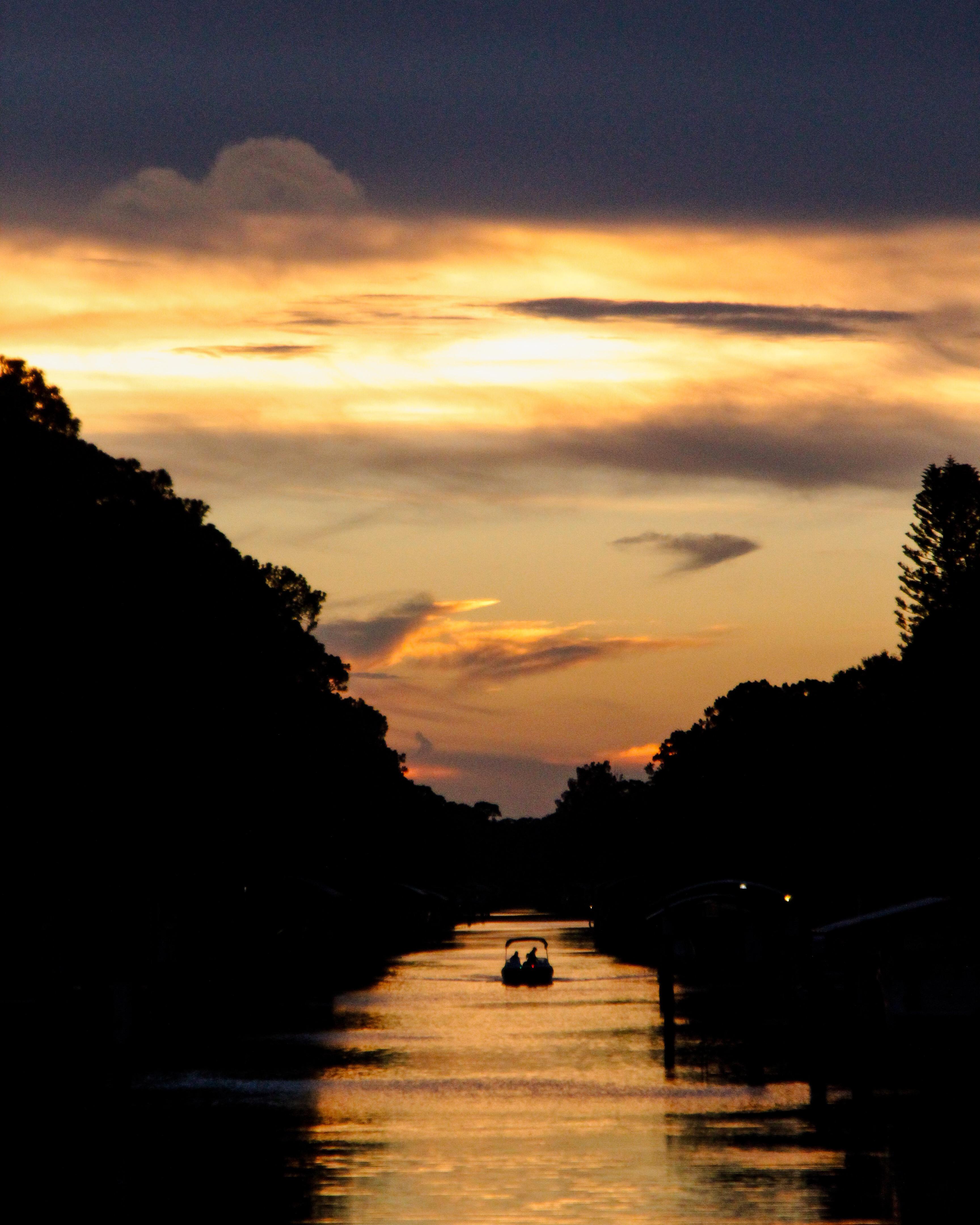 Floating home under the setting sun | Scrolller