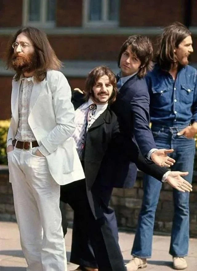 The Beatles waiting to cross Abbey Road, 1969 | Scrolller