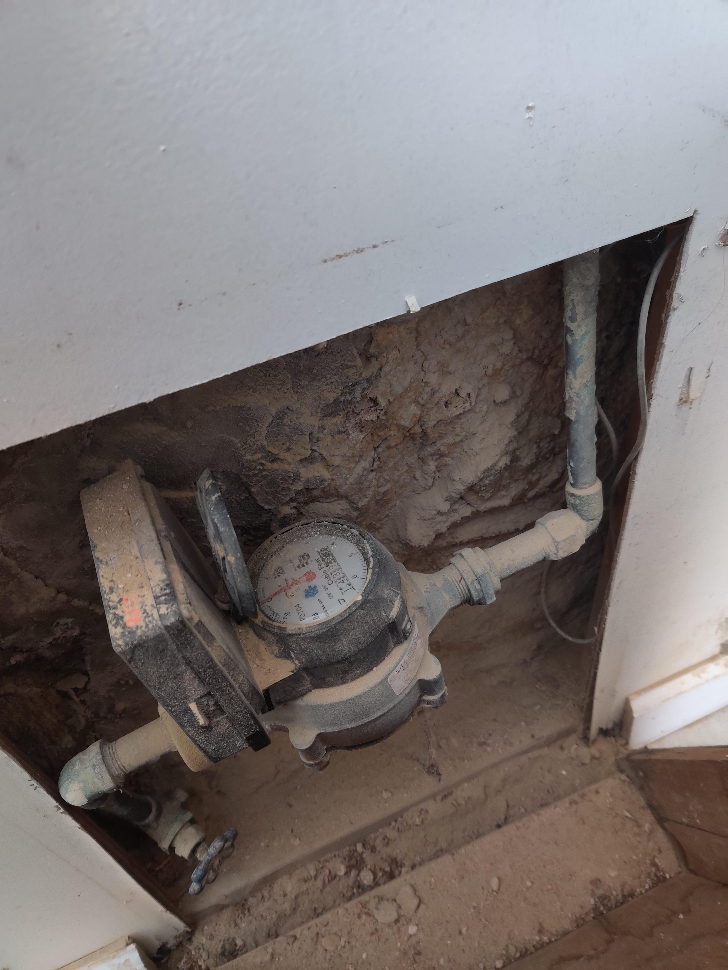 Any ideas why dirt would build up here? This is in my basement behind drywall by the water shut ...