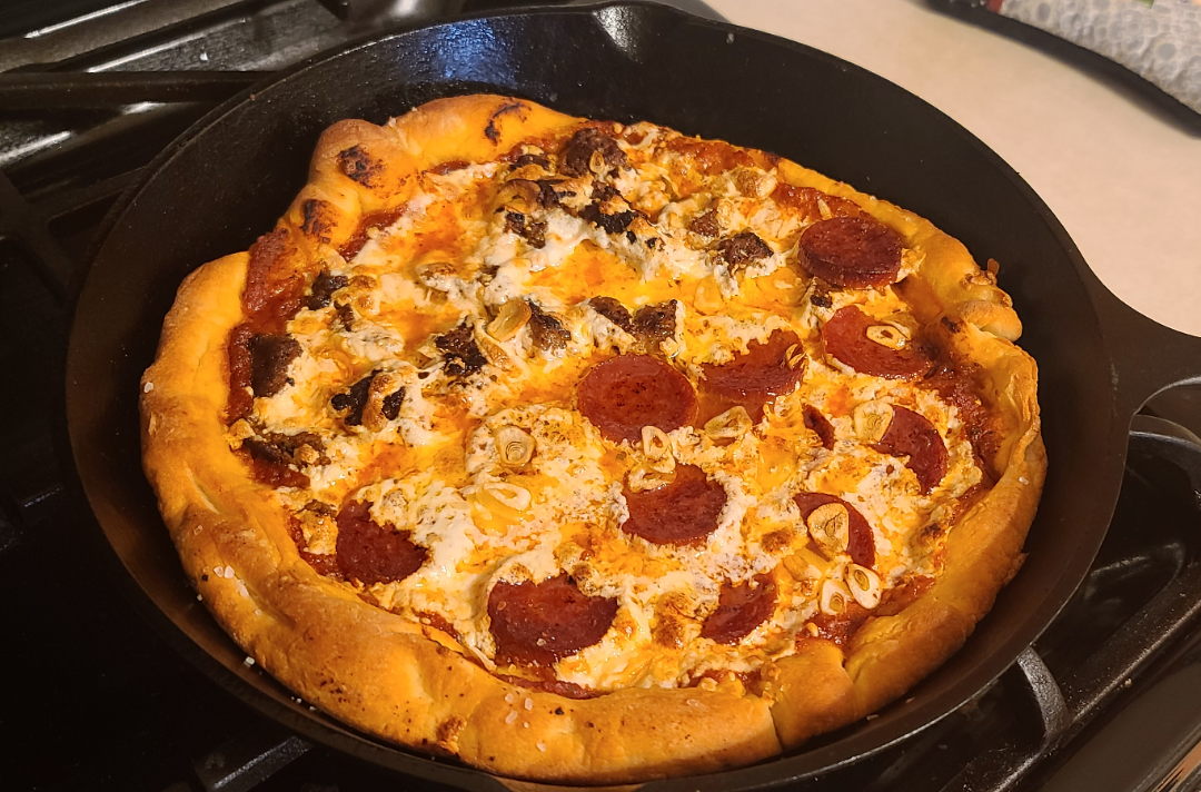 [homemade] cast iron pizza. half salami picante half chaurice sausage | Scrolller