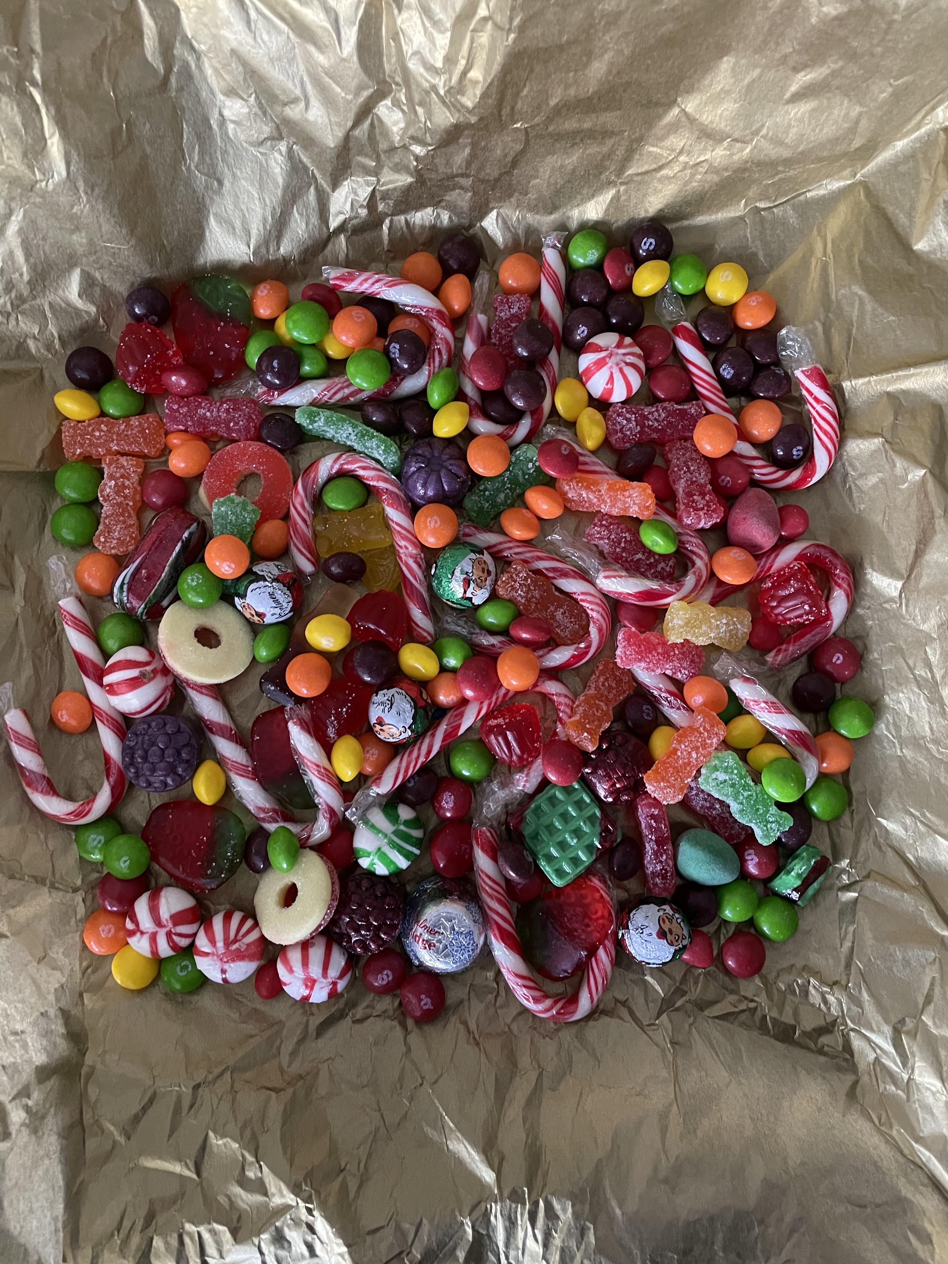 Can someone photoshop this bear + candy cane onto the candy pile? I tried and can't get it to ...