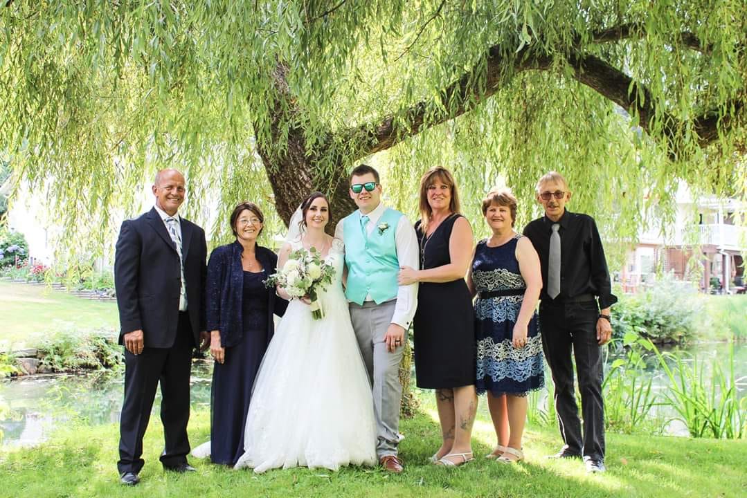 Can you add my papa in the second image into the first one between the older lady on the right ...