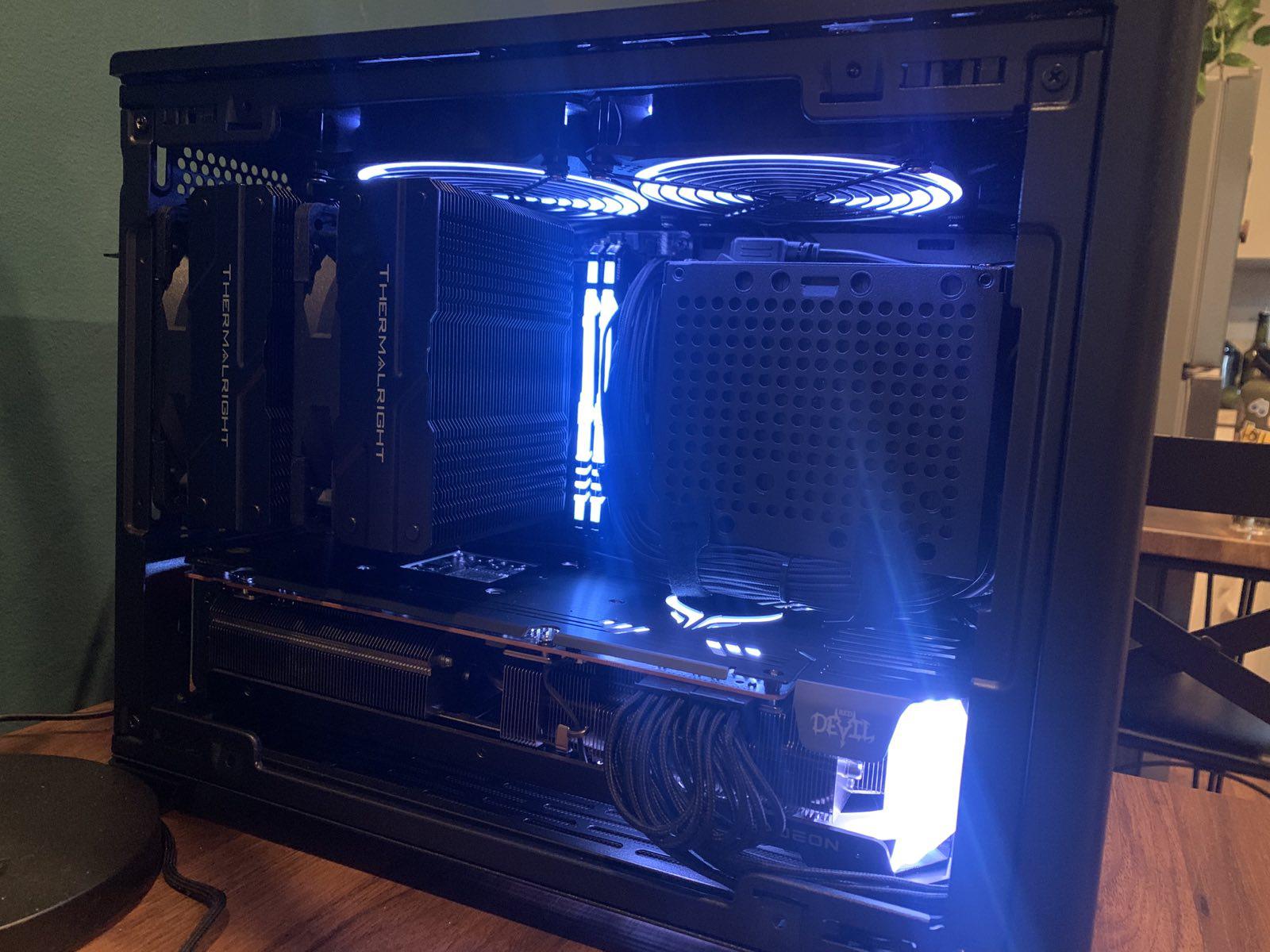 Sleek Black NR200P Build with RGB | Scrolller