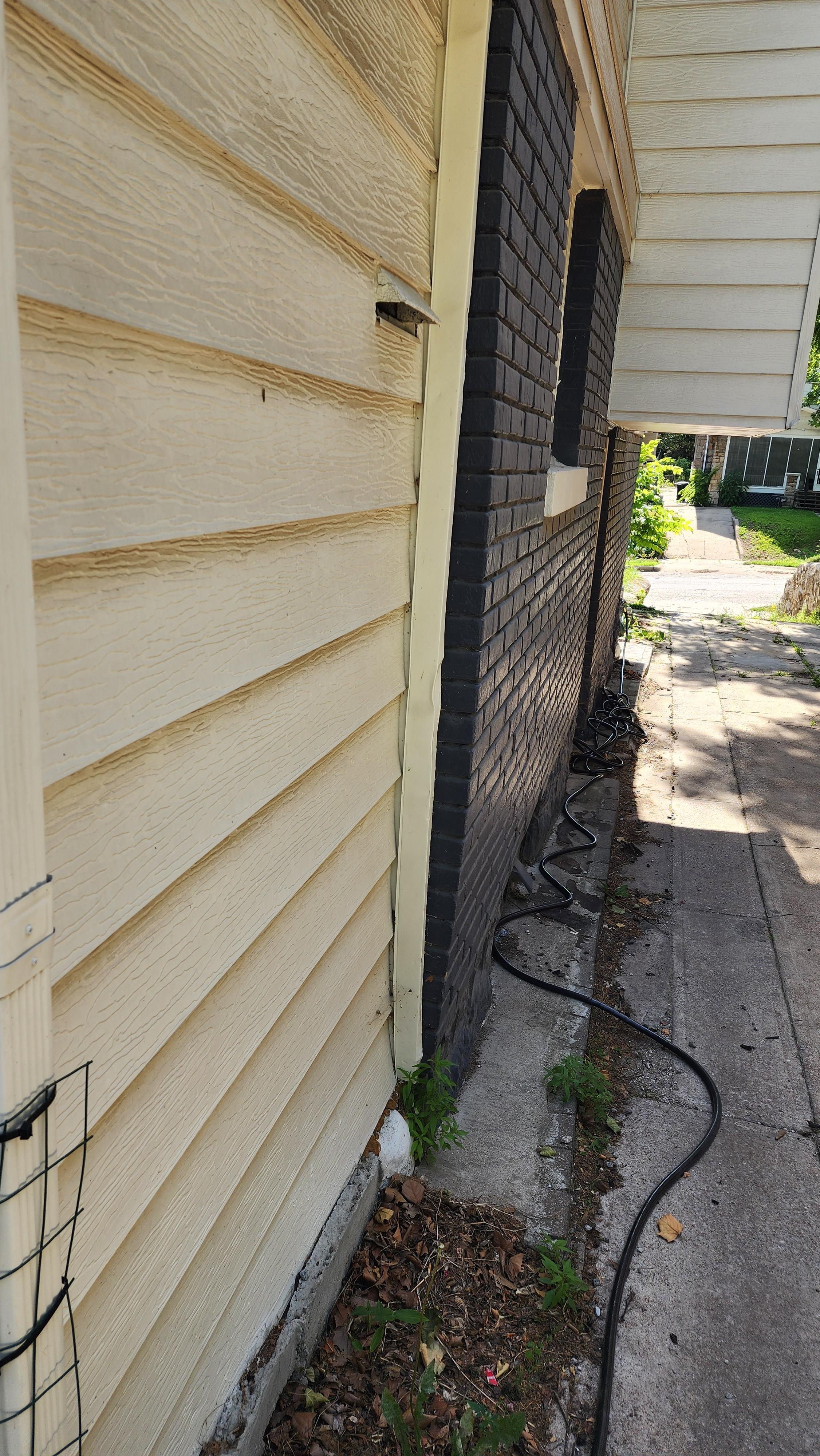 Bulging Exterior Brick Wall Scrolller