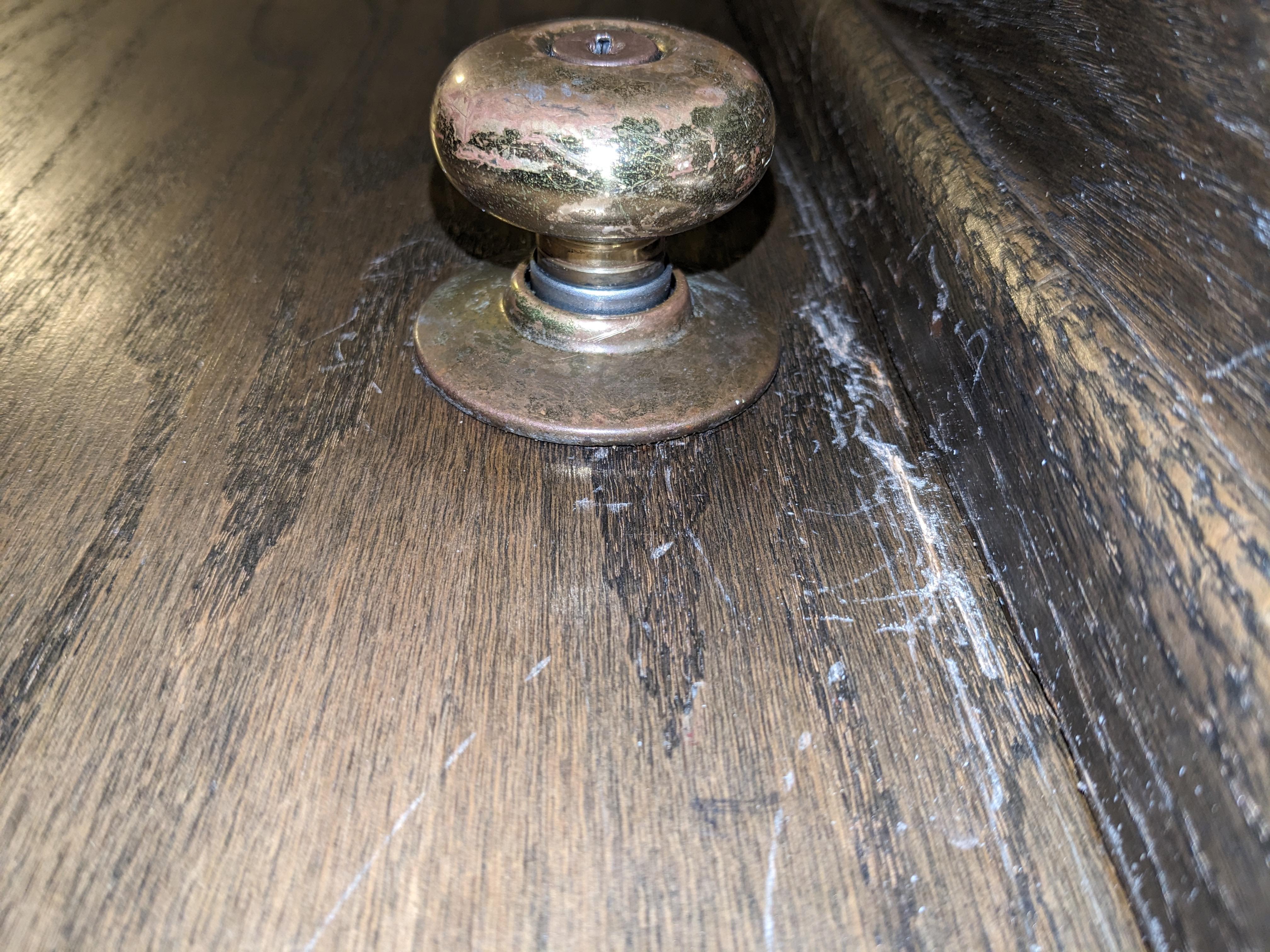 How to remove door knob or unlatch door? No visible screws, slots, pin holes, etc. | Scrolller