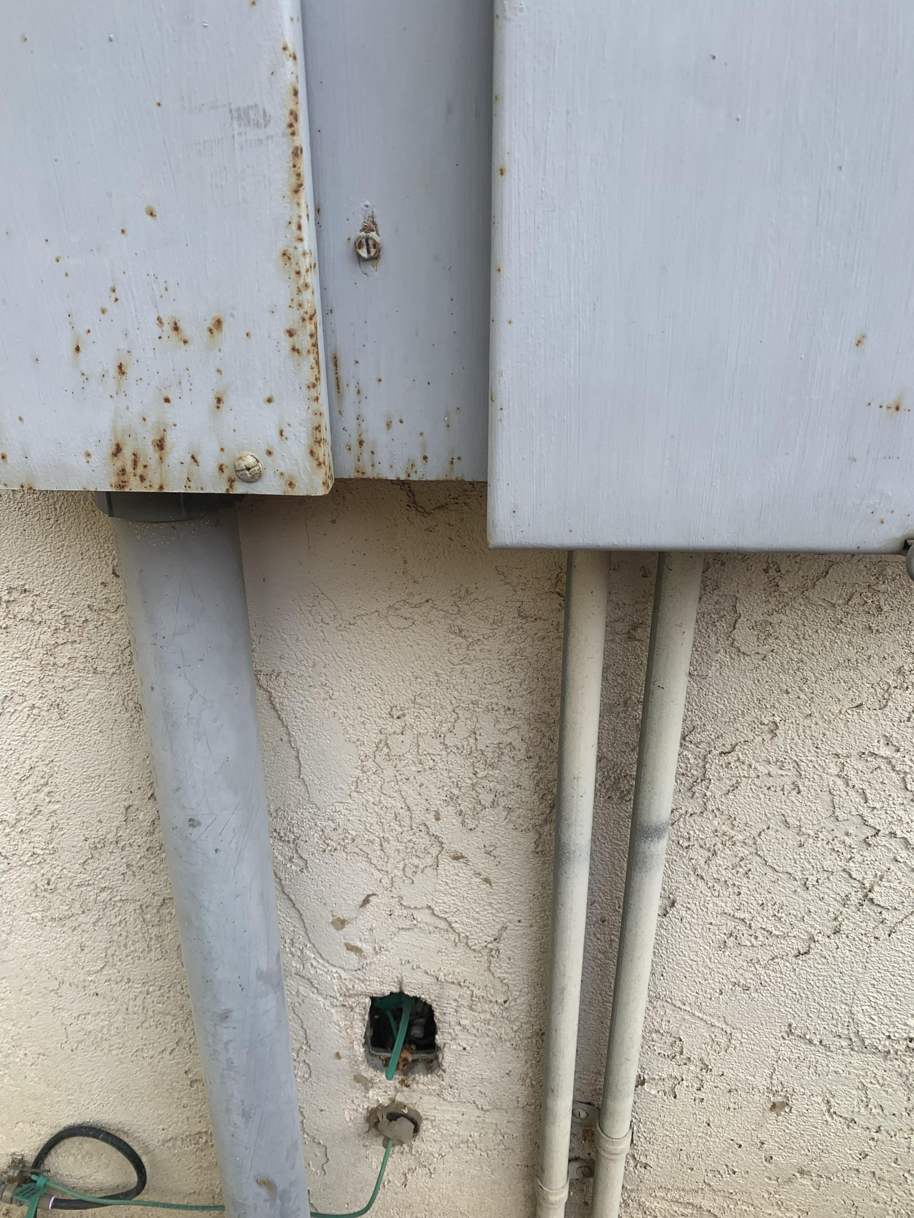 Why is there a hole in this wall below the fuse box and how do I cover it? | Scrolller