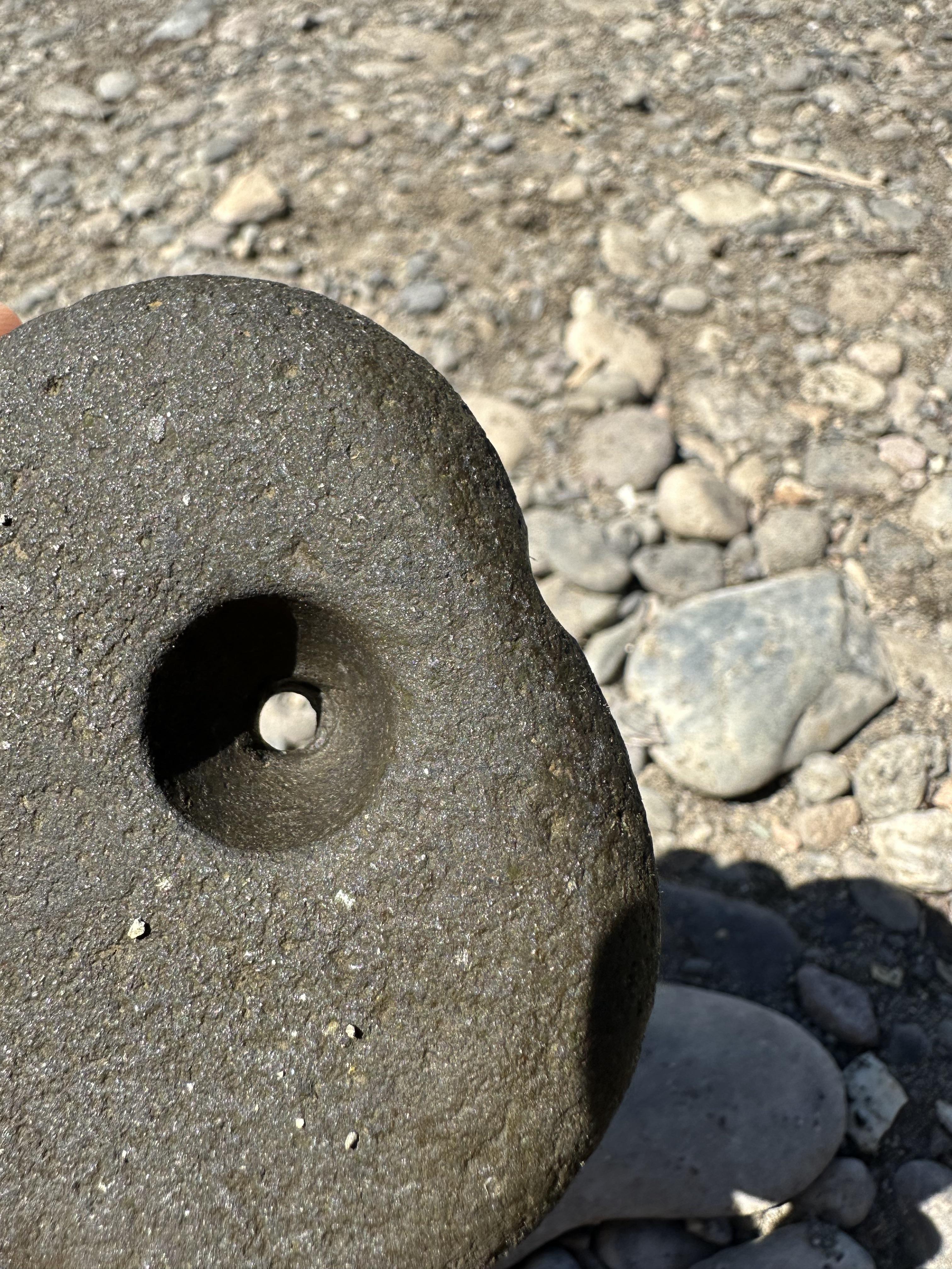 Strange rock by the river | Scrolller