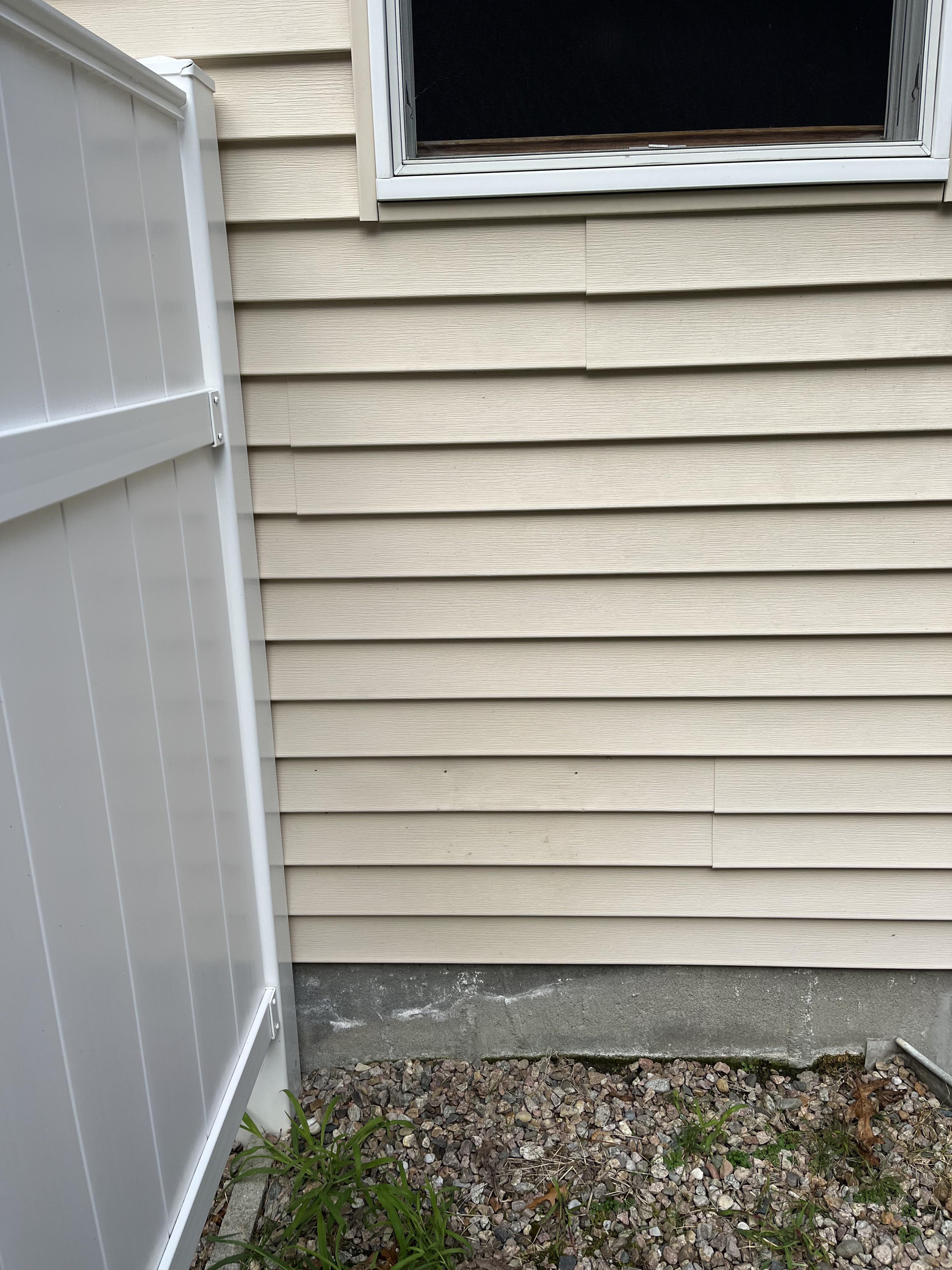 Wet spot/efflorescence on outside foundation | Scrolller