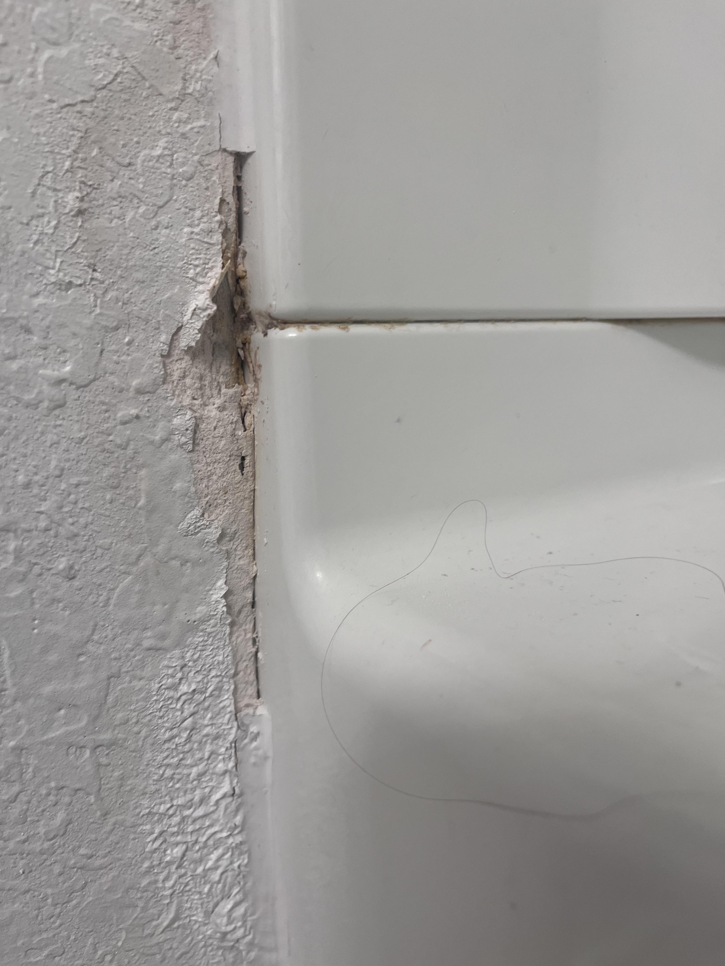 Drywall water damage next to bathtub. Is this normal? | Scrolller