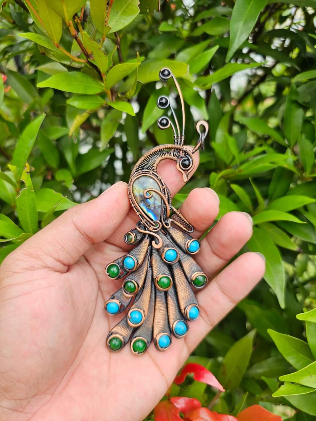 Just want to share the work that i made !!. I made a peacock pendant from wire wrapping.hope the ...