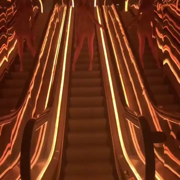 A girl in golden escalator | Scrolller