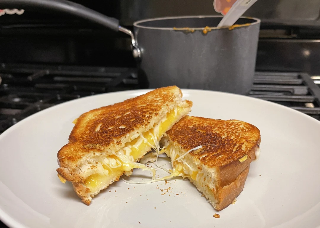 Shredded Mexican four cheese and shredded mozzarella on white bread with butternut squash soup ...
