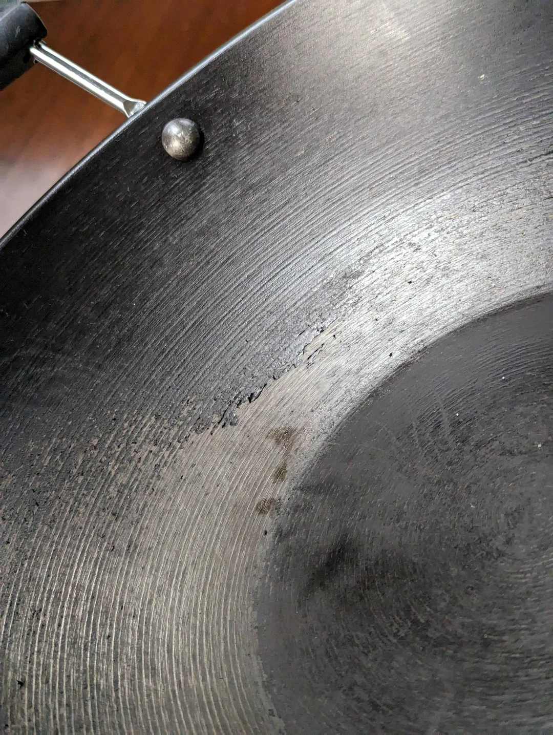 The pre-seasoning of my cheap pan is flaking off. Any tips on removing the layer? | Scrolller