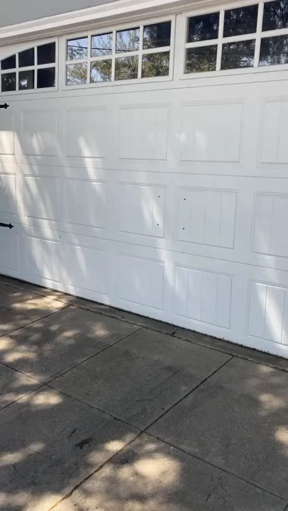 Kid discovers the danger of standing too close to a garage door. | Scrolller