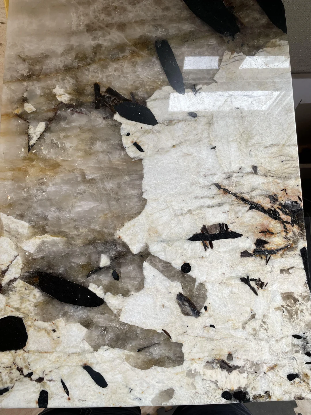 Where and how was this amazing granite piece created? What created these black opacities? And ...