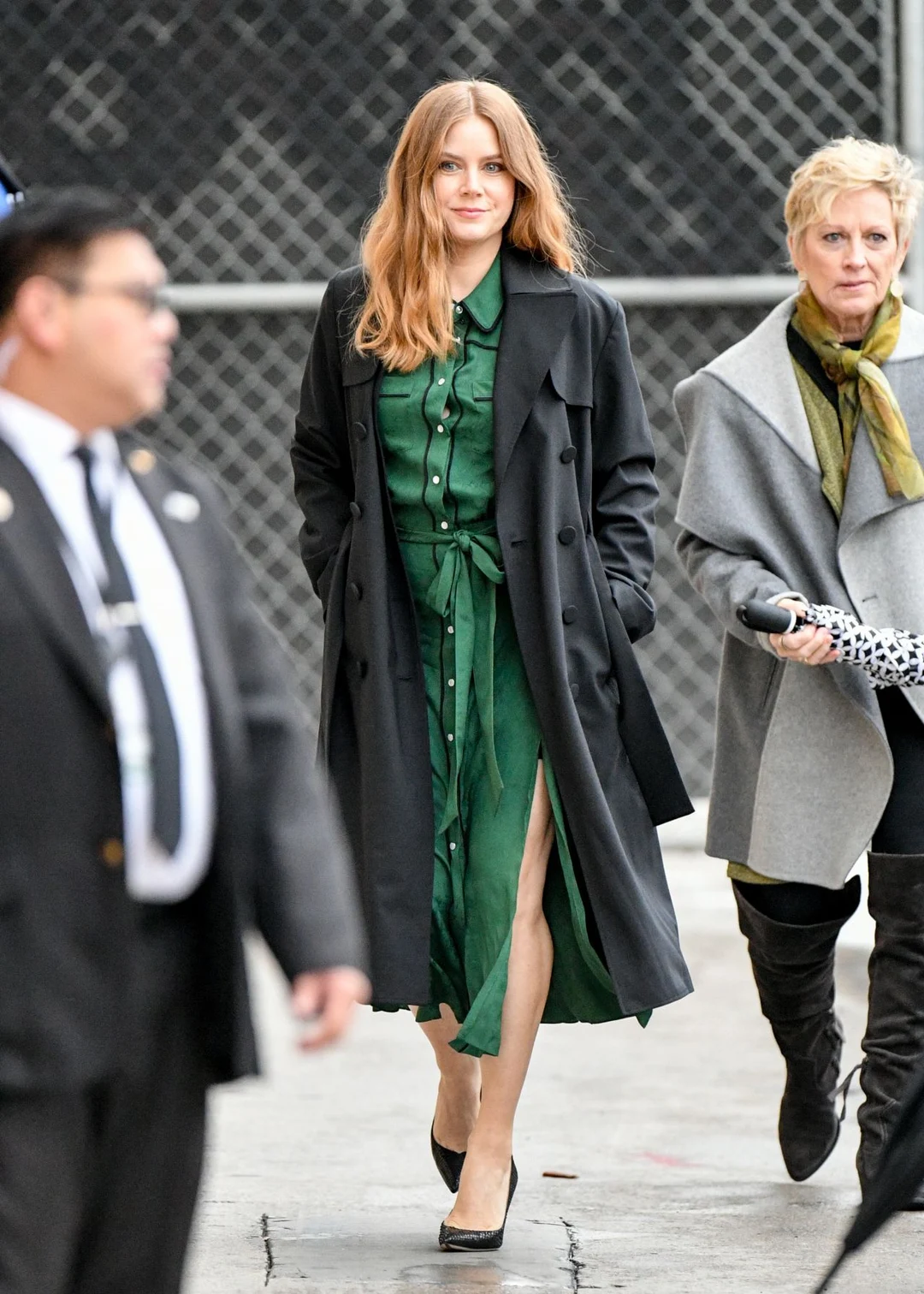 Trench coat over a green dress | Scrolller