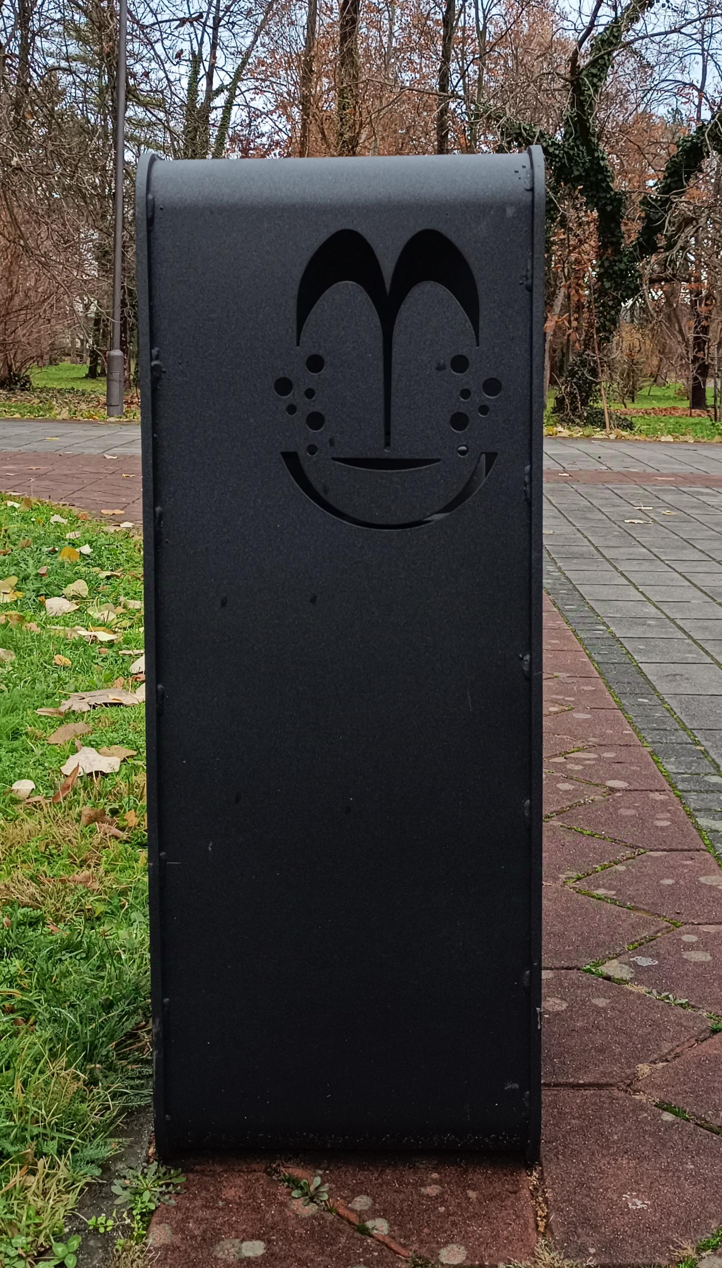 Smiley face on trash bin | Scrolller