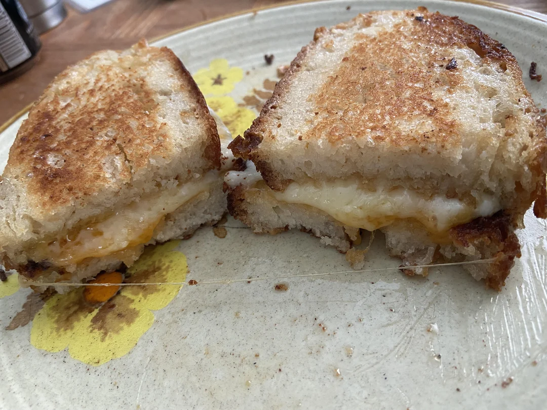 Homemade sourdough spread with mayo, cheddar, mozz, provolone fried in a little bacon grease ...