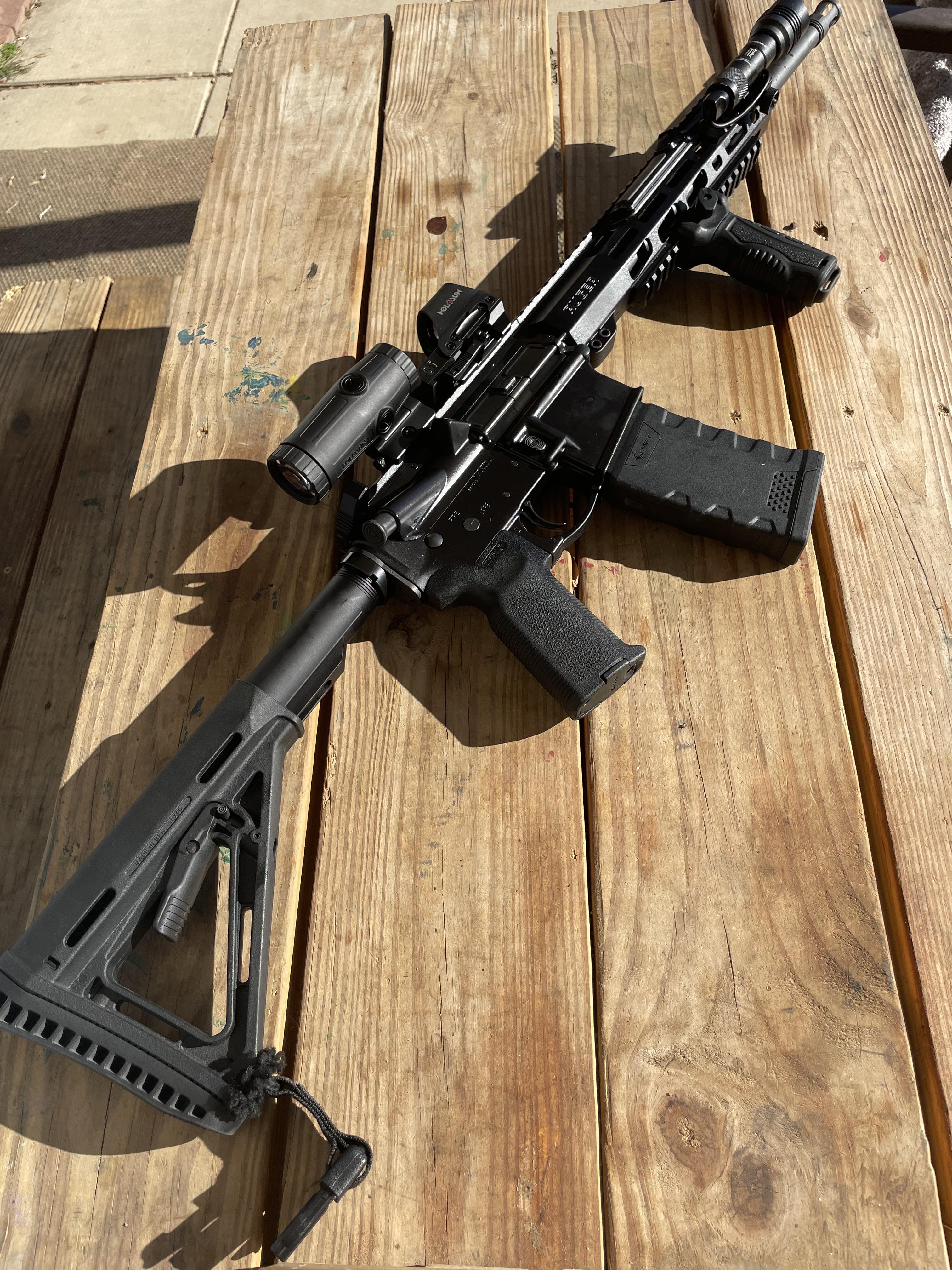 What is the purpose of the triangular part of the upper receiver? | Scrolller