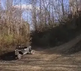 ATV going up a steep hill | Scrolller