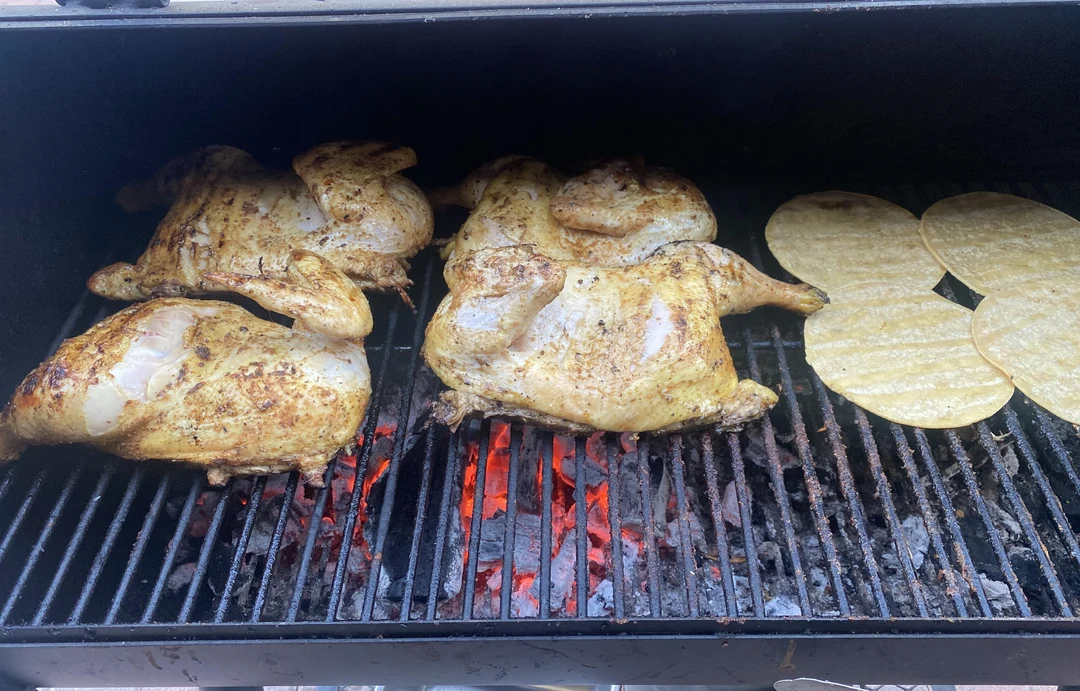 Half chicken on grill | Scrolller