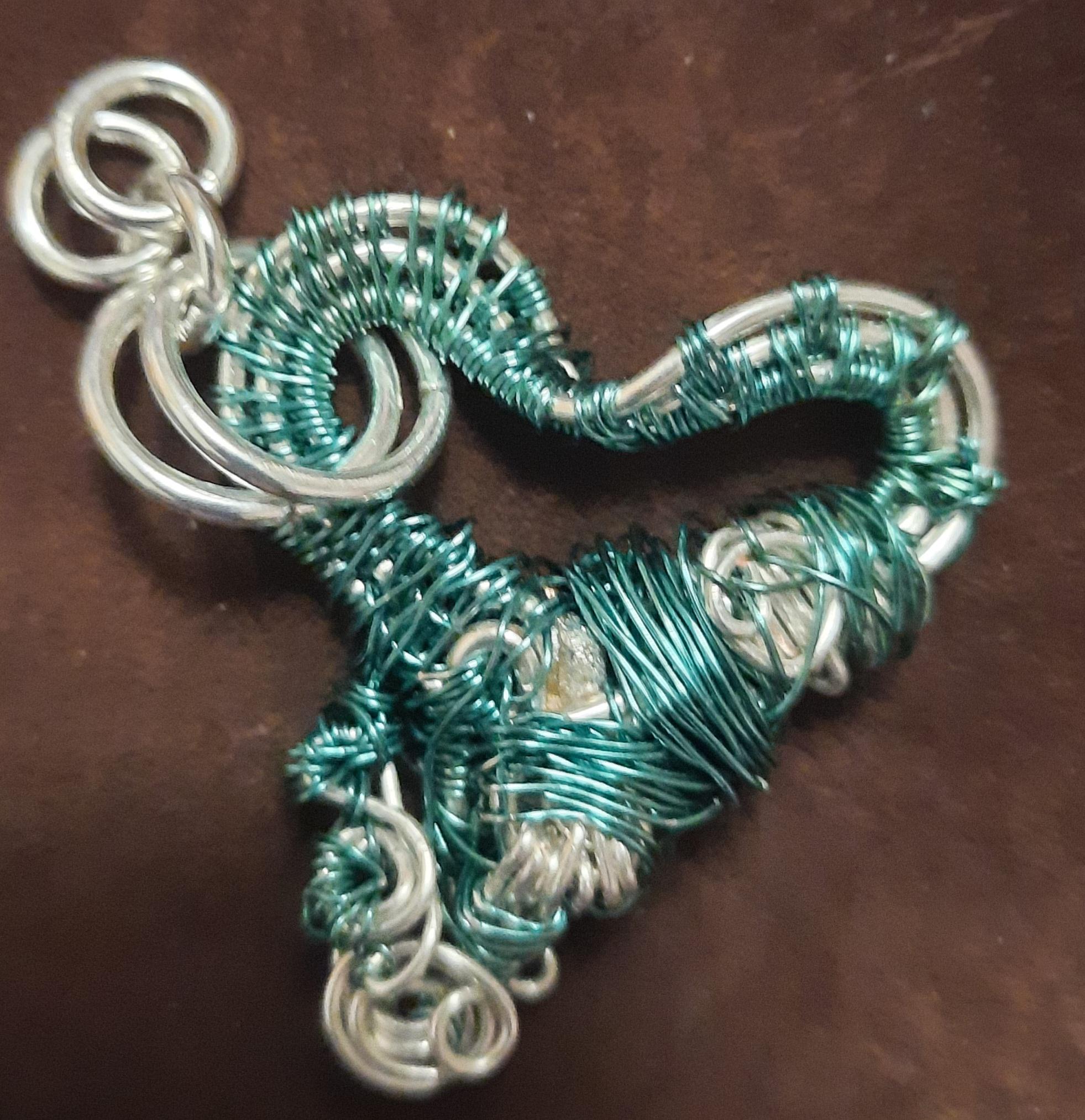 Wire heart pendant. | Scrolller