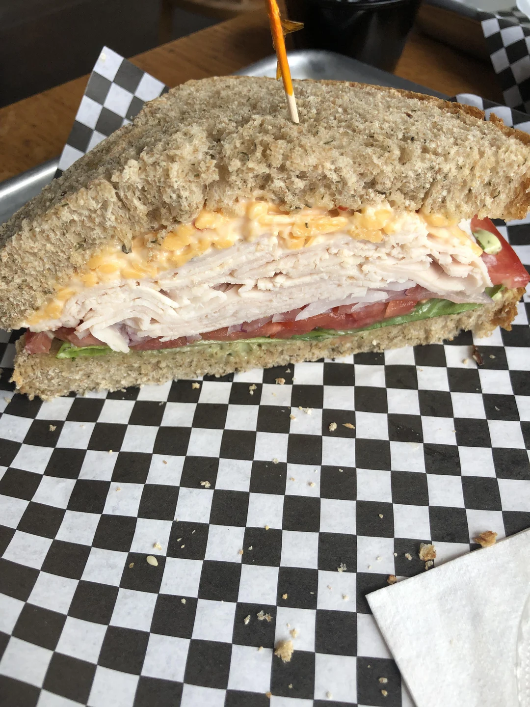 Turkey, Pimento Cheese, Tomatoes, Lettuce, Red Onion, and herb mayo on hearty wheat bread ...