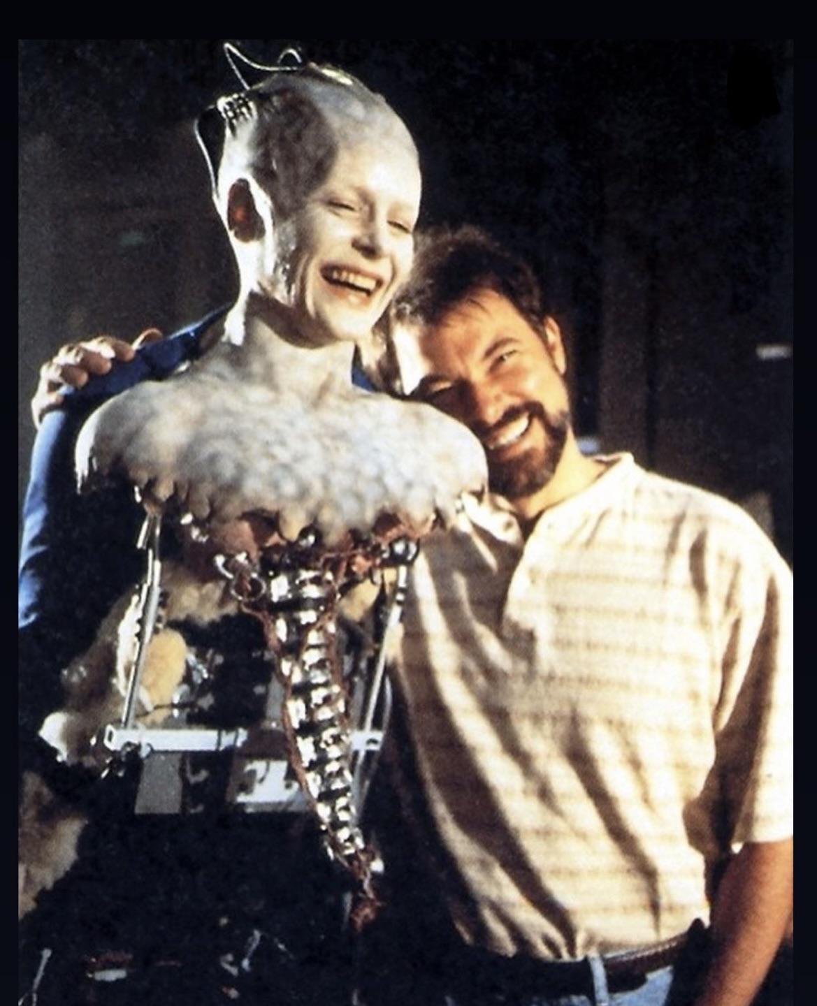 Behind the scenes photo of Alice Krige, in costume as Borg Queen, and Jonathan Frakes, director ...