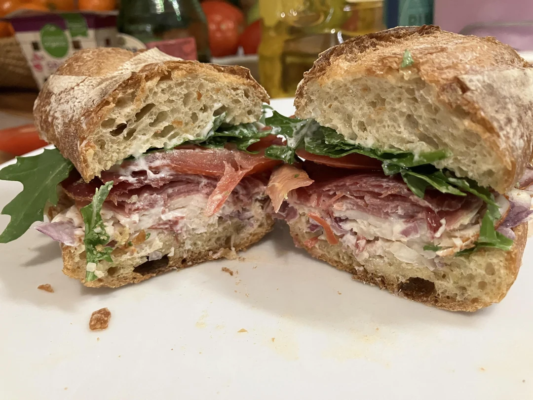 baguette, red onion, turkey, salami, hot capocollo, tomato, arugula, chard, vinegar oil mayo and ...