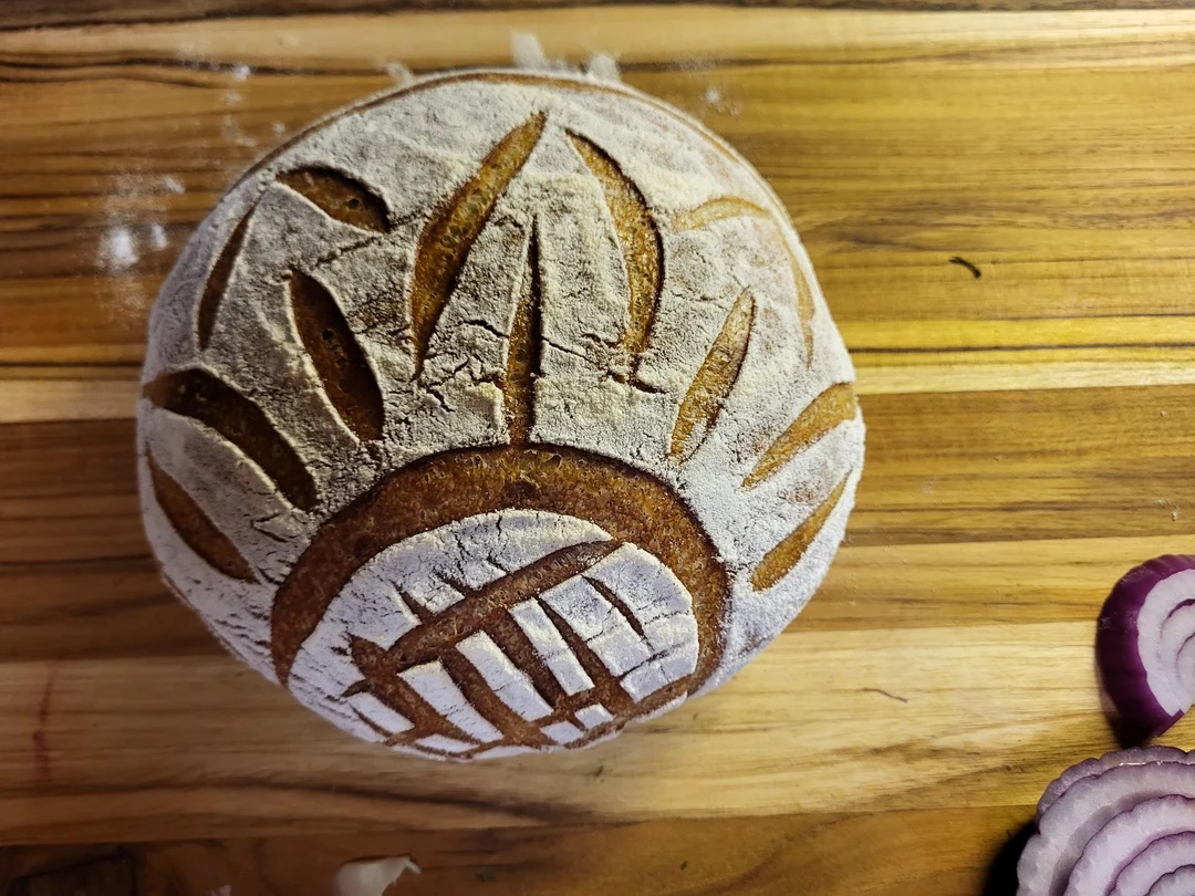 My wife's first attempt at fancy scoring on her sourdough loaf, thought it was cute | Scrolller