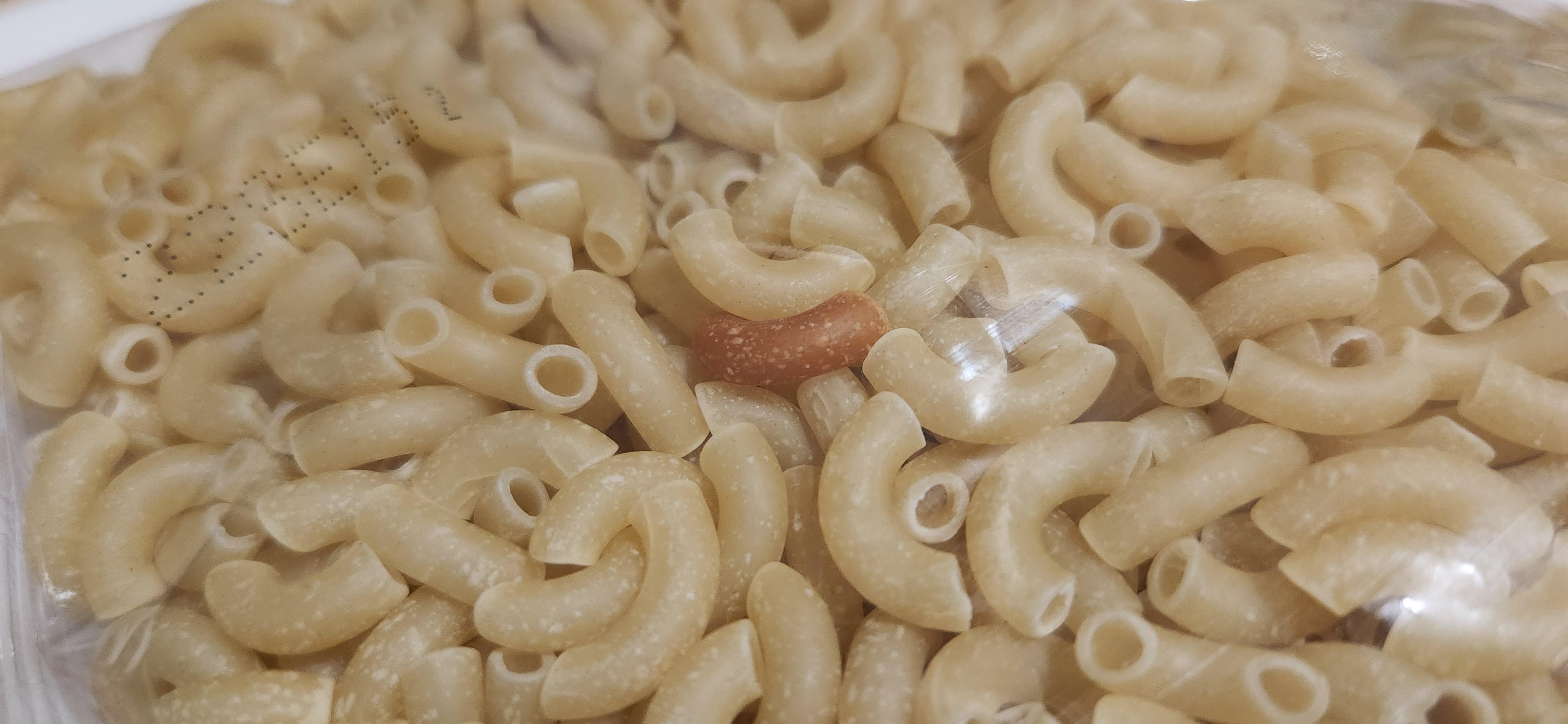 Was making dinner and noticed this shiny macaroni noodle. | Scrolller