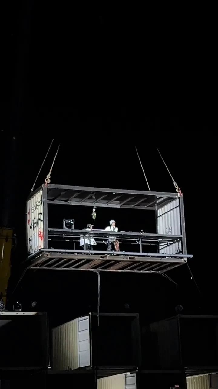 ISOKNOCK playing from a shipping container hanging from a crane @ north coast | Scrolller